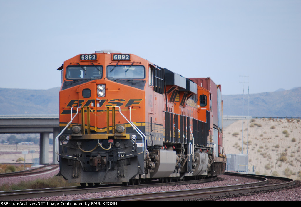 BNSF 6892 with her Sister ES44C4 BNSF 6897 pass me as they push a Hot Z eastward into the BNSF ...
